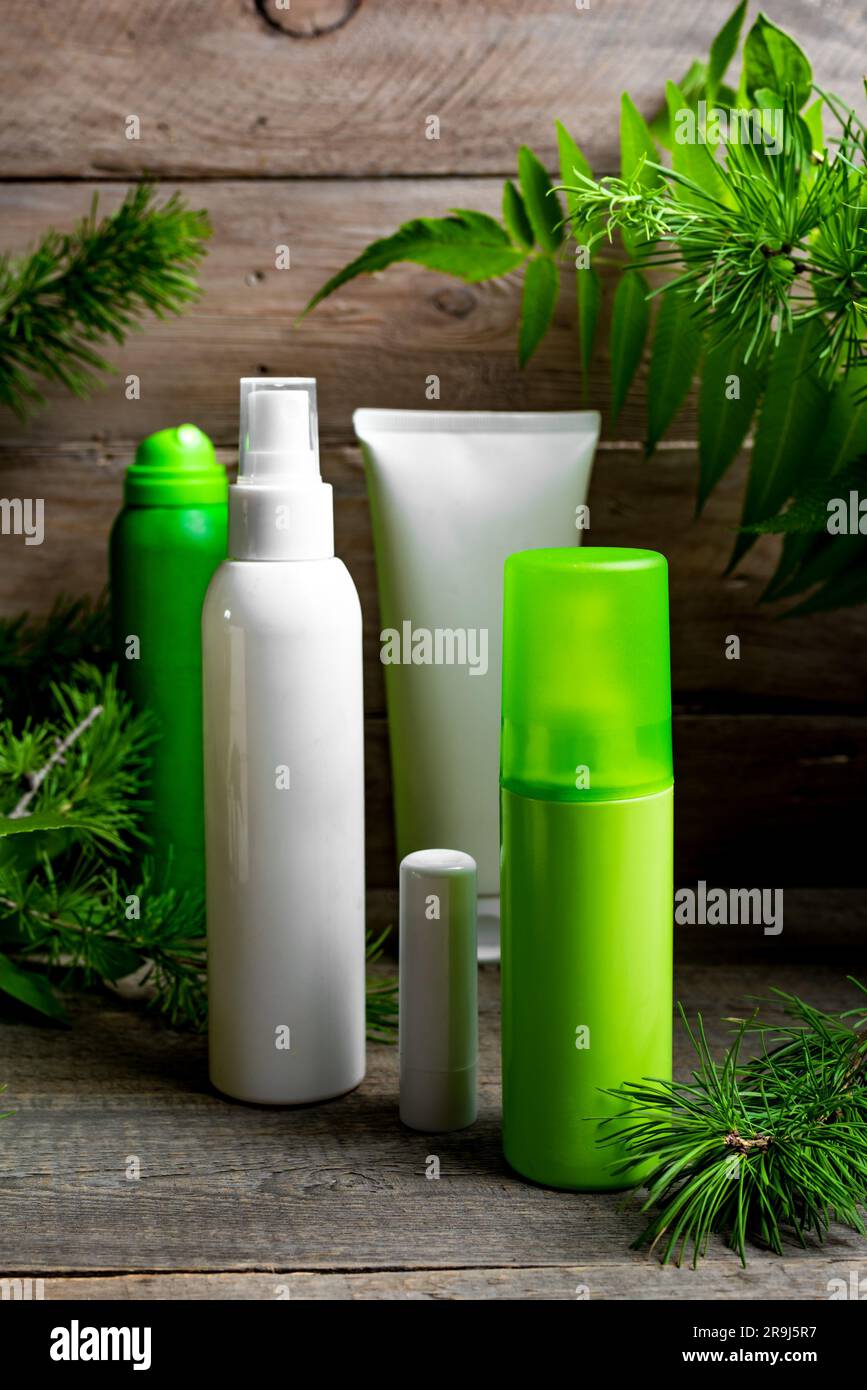 Mosquito repellents and sprays anti stinging insects on wooden ...