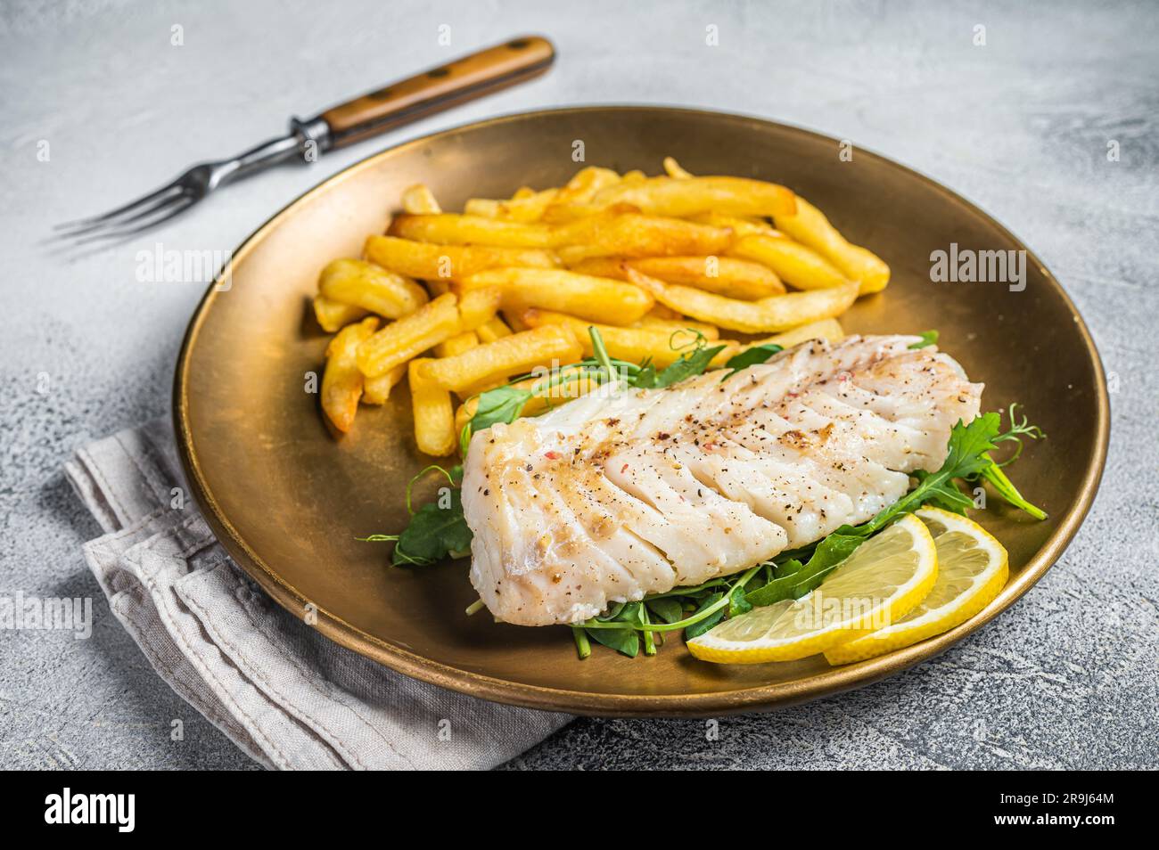 Fried cod fish fillet served with french fries. White background. Top ...
