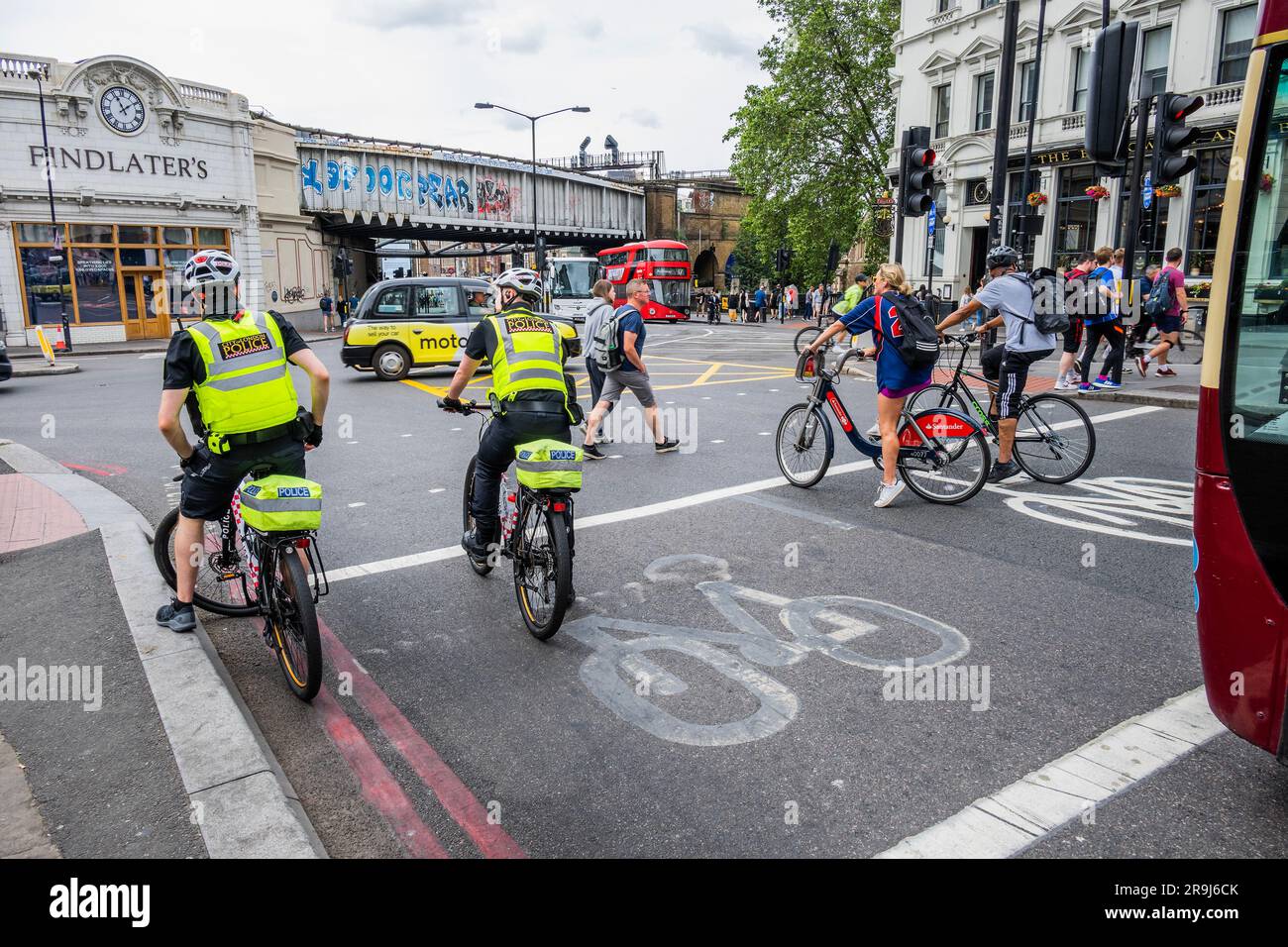 London, UK. 27th June, 2023. City of London Police cyclists pass by on ...