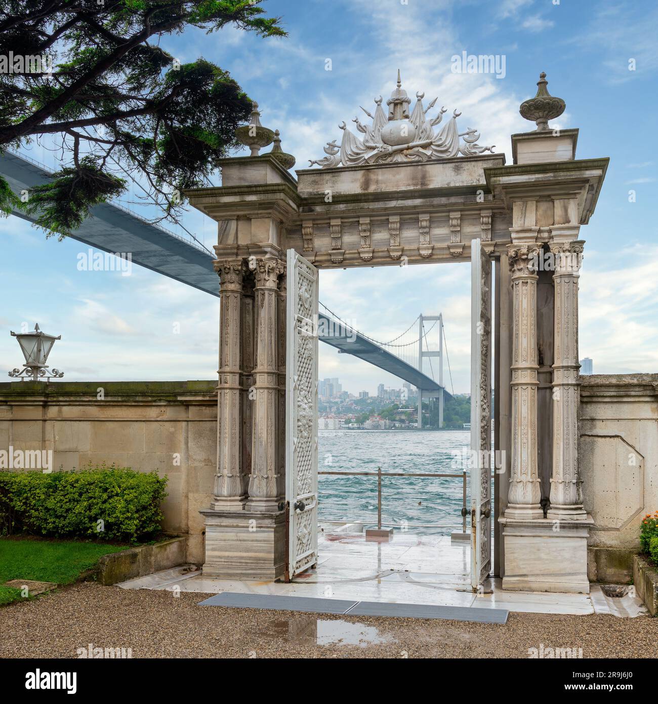 Marble gate with decorated open door leading to the Bosphorus Strait ...