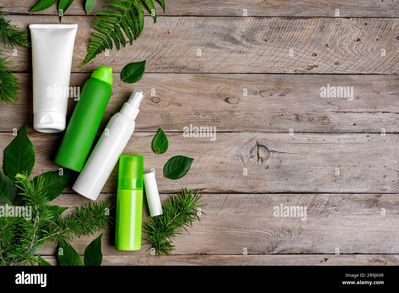 Mosquito repellents and sprays anti stinging insects on wooden ...