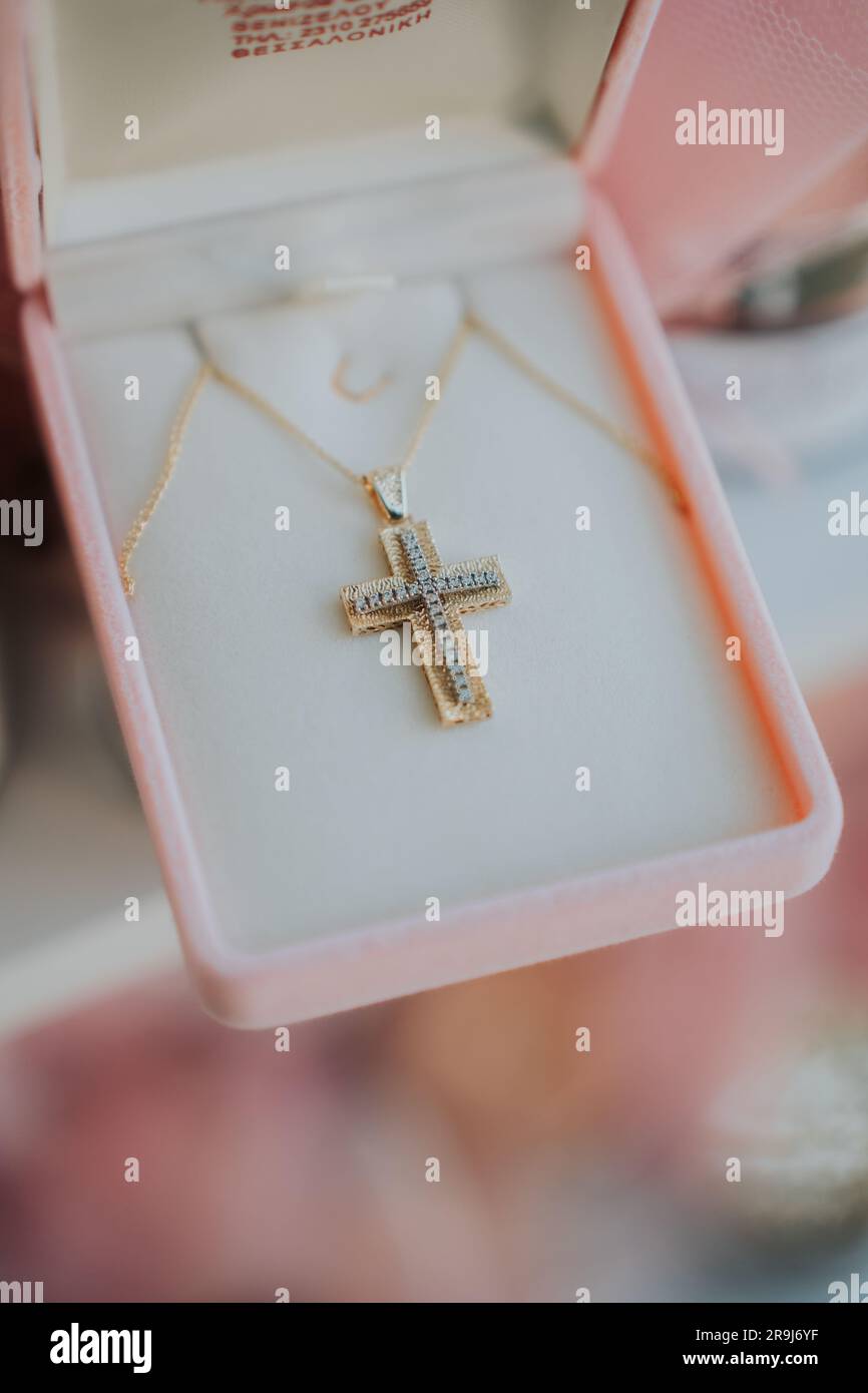 A golden cross inside a wooden box for the baptism ceremony Stock Photo ...
