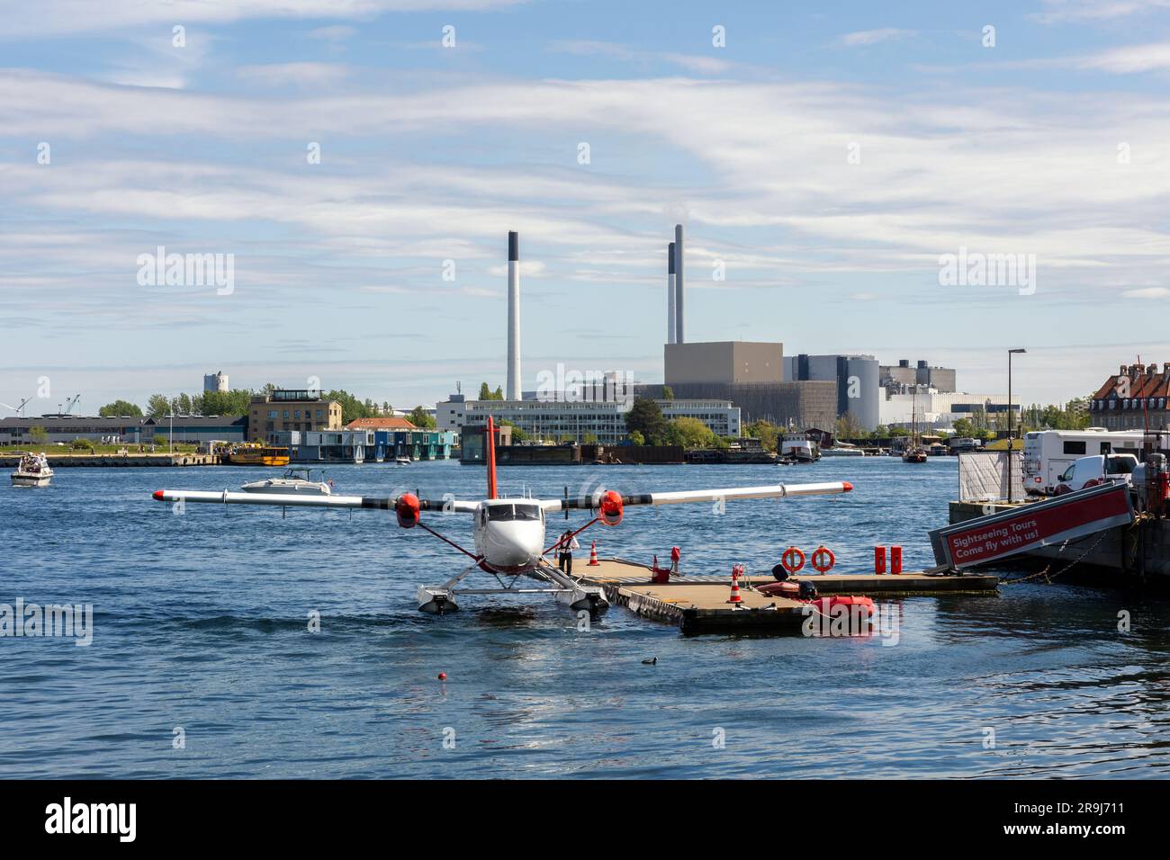 Small modern propeller business charter seaplane landing at Copenhagen ...