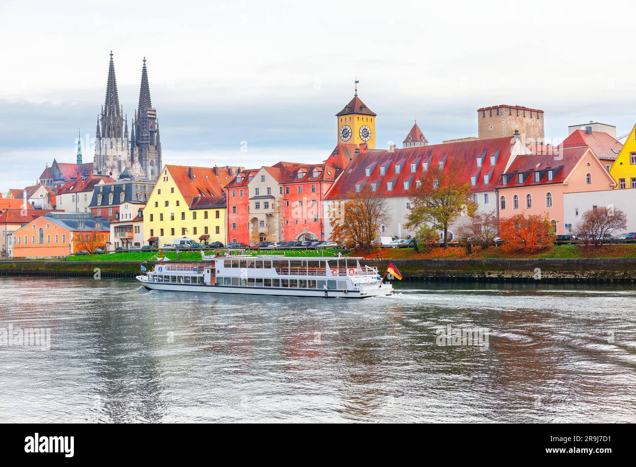 Regensburg city on a river in Bavaria , Germany . Tourist boat on the ...