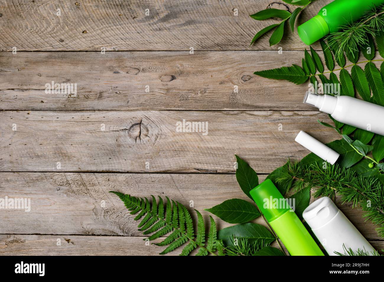 Mosquito repellents and sprays anti stinging insects on wooden ...
