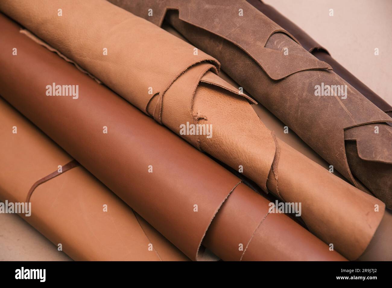 An array of leather fabric samples in different shades neatly placed on ...