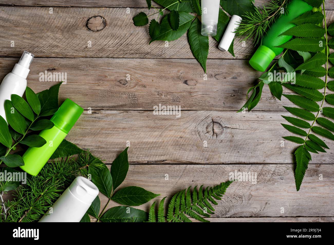 Mosquito repellents and sprays anti stinging insects on wooden ...