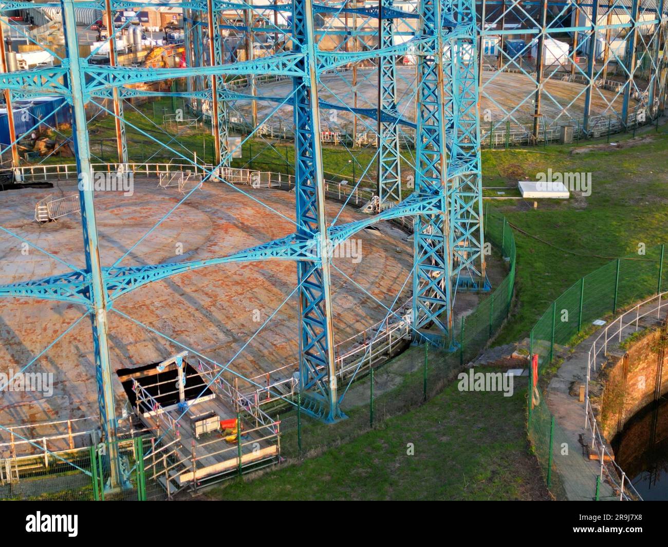 An aerial view of a column-guided gas holder surrounded by industrial ...