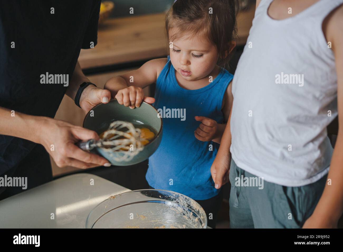 Mother and daughter cooking pasta in kitchen Stock Photo - Alamy