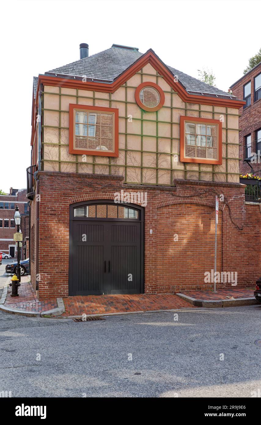 Green lattice and red window surrounds float on the stucco walls of ...