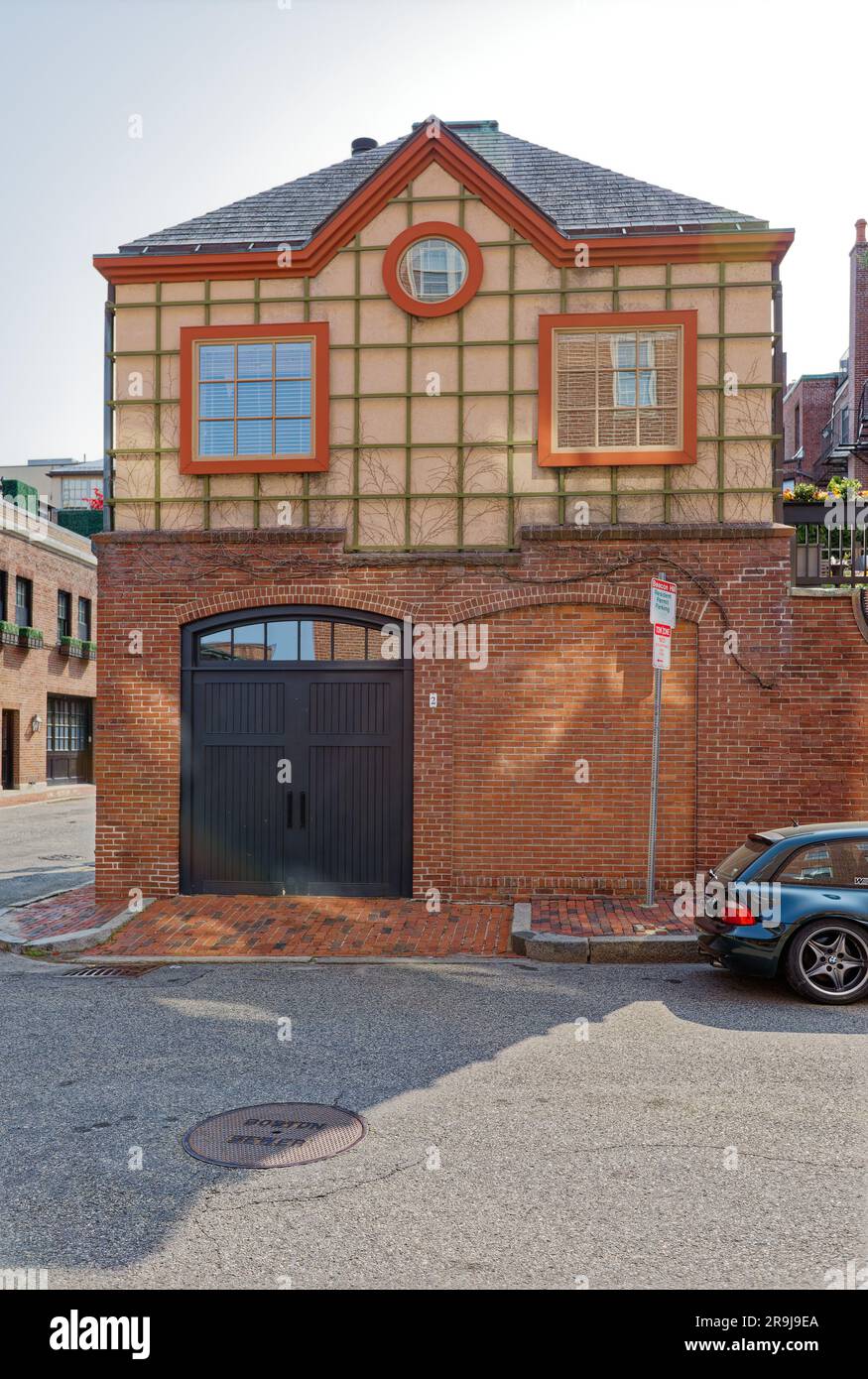 Green lattice and red window surrounds float on the stucco walls of ...