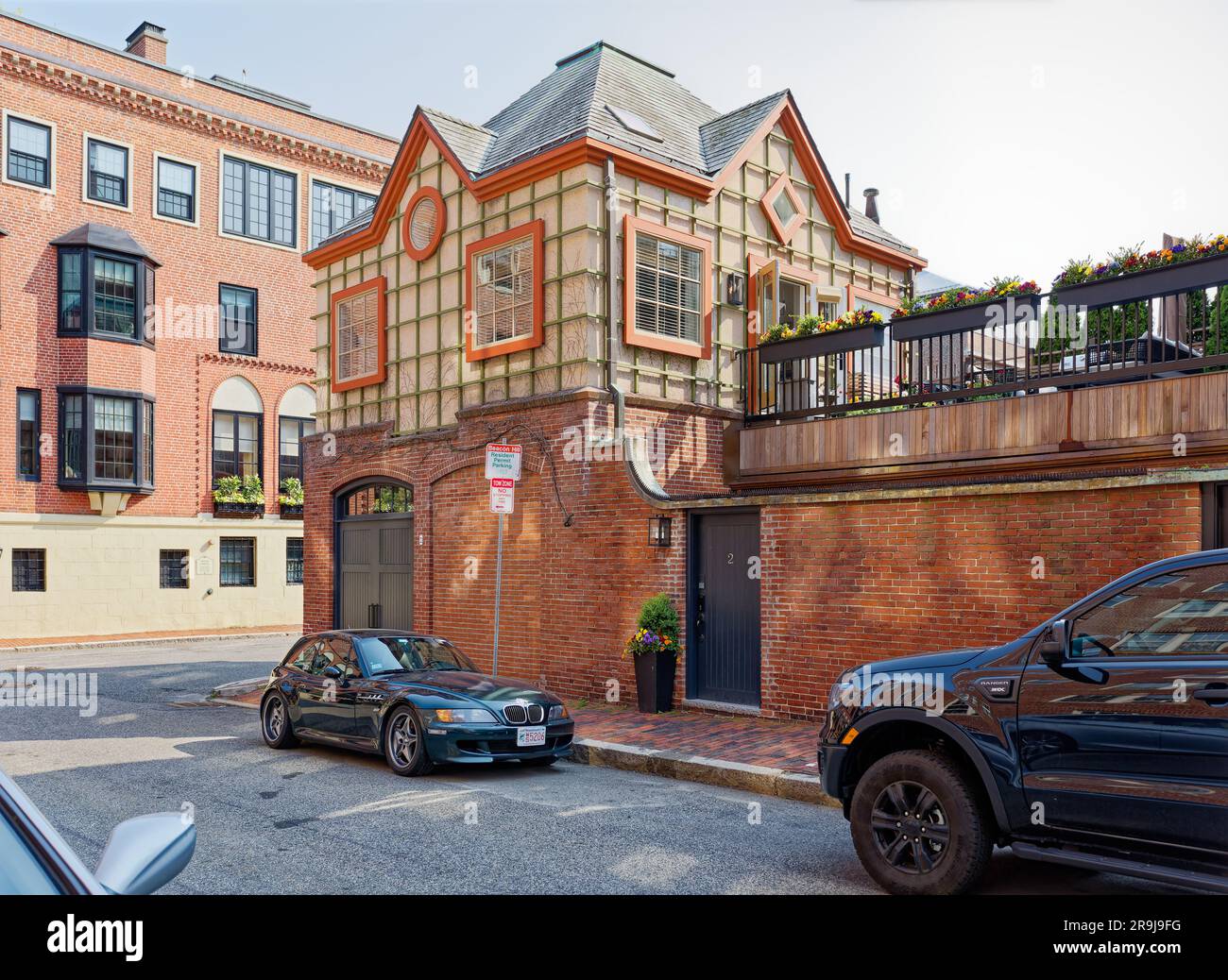 Green lattice and red window surrounds float on the stucco walls of ...