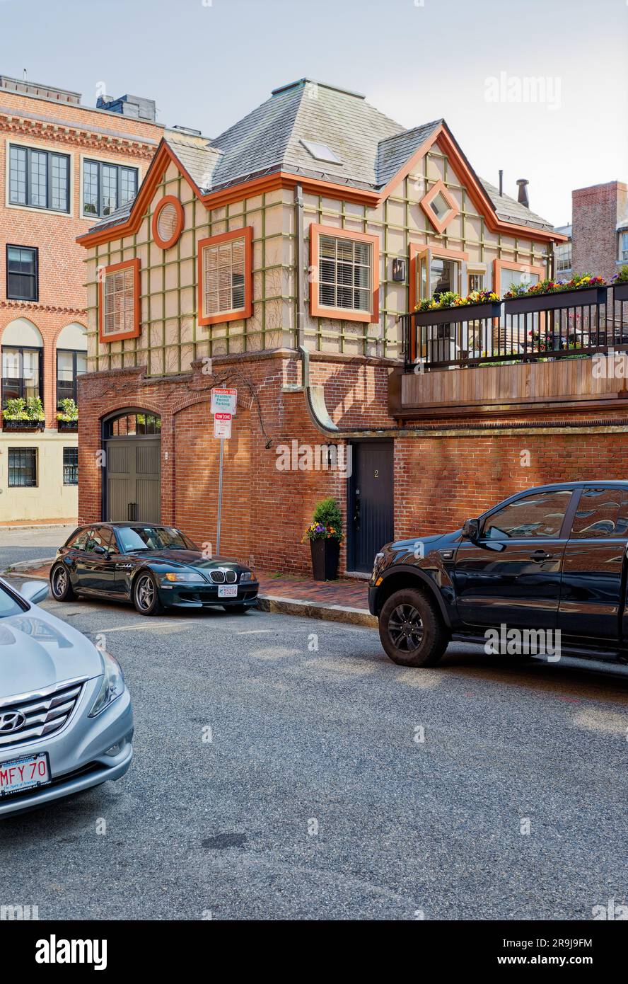Green lattice and red window surrounds float on the stucco walls of ...