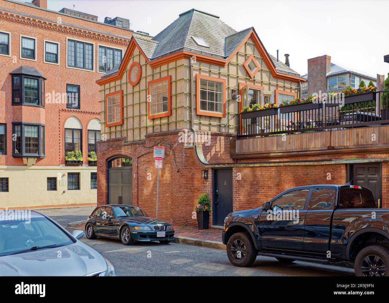 Green lattice and red window surrounds float on the stucco walls of ...