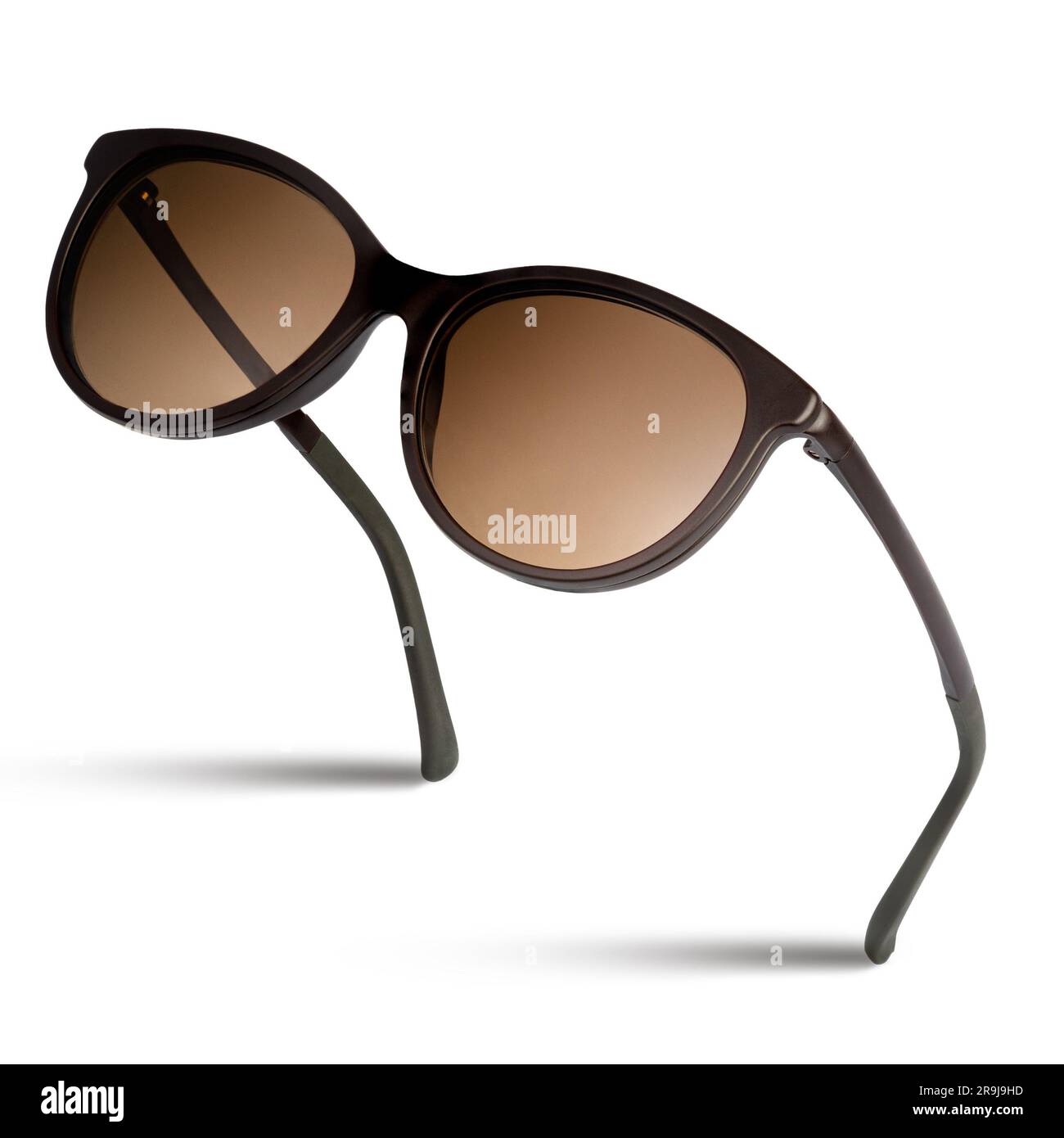 Brown sunglasses on white background with shadows Stock Photo - Alamy