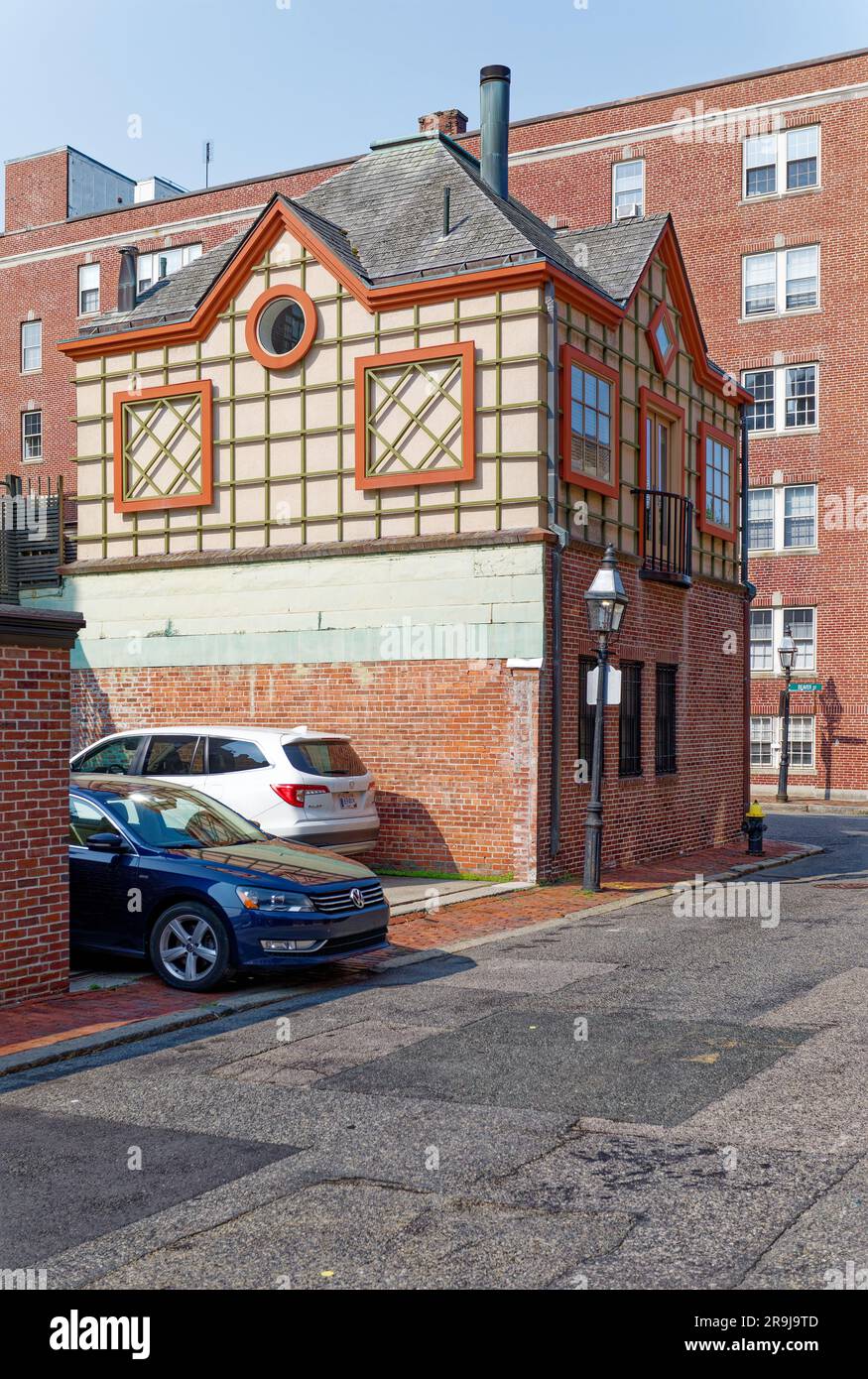 Green lattice and red window surrounds float on the stucco walls of ...