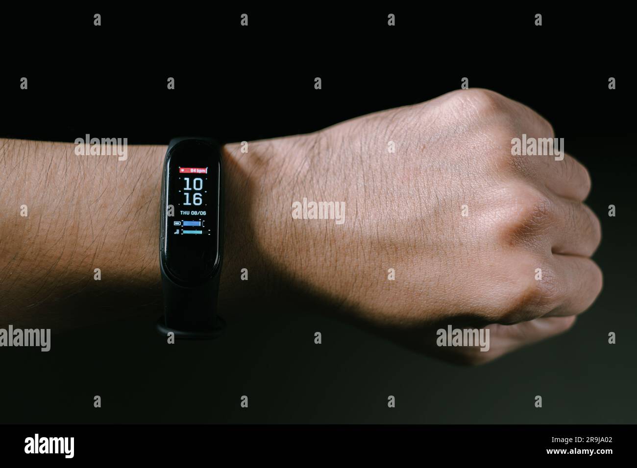 A Smartwatch In The Hand Of Men Is Showing Time Real Time Heart Rate Battery And Steps
