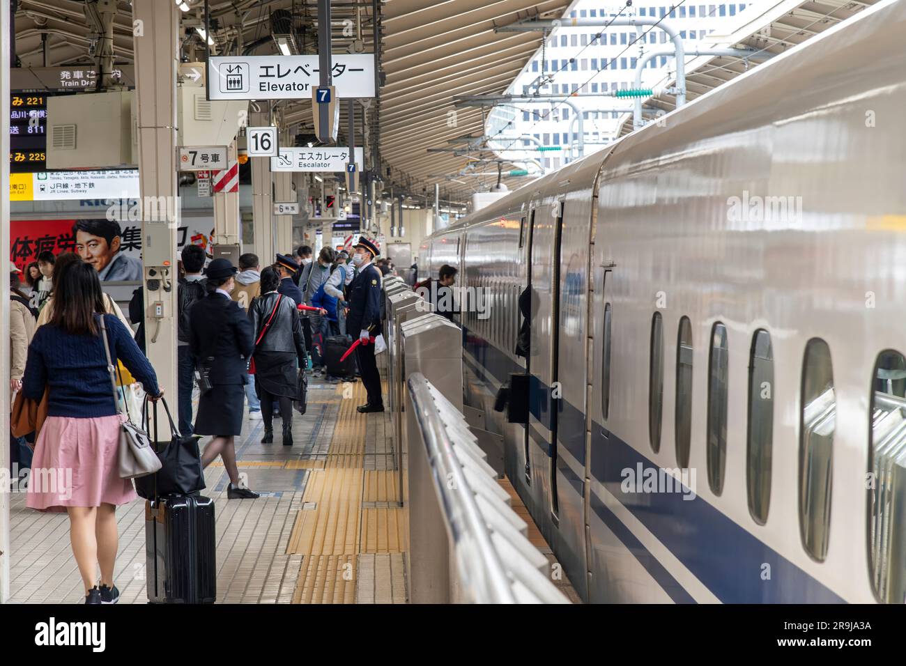 Tokyo, Japan-April 2023; View of one of the platforms of the station with passengers ready to ...