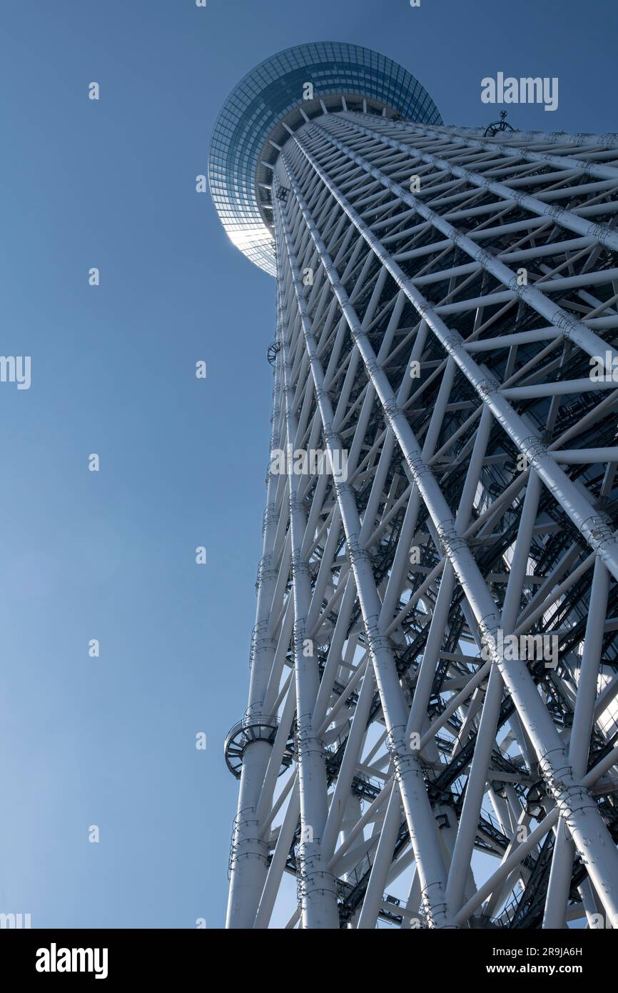 Tokyo, Japan-April 2023; Vertical low angle view of the Tokyo Skytree observation and ...