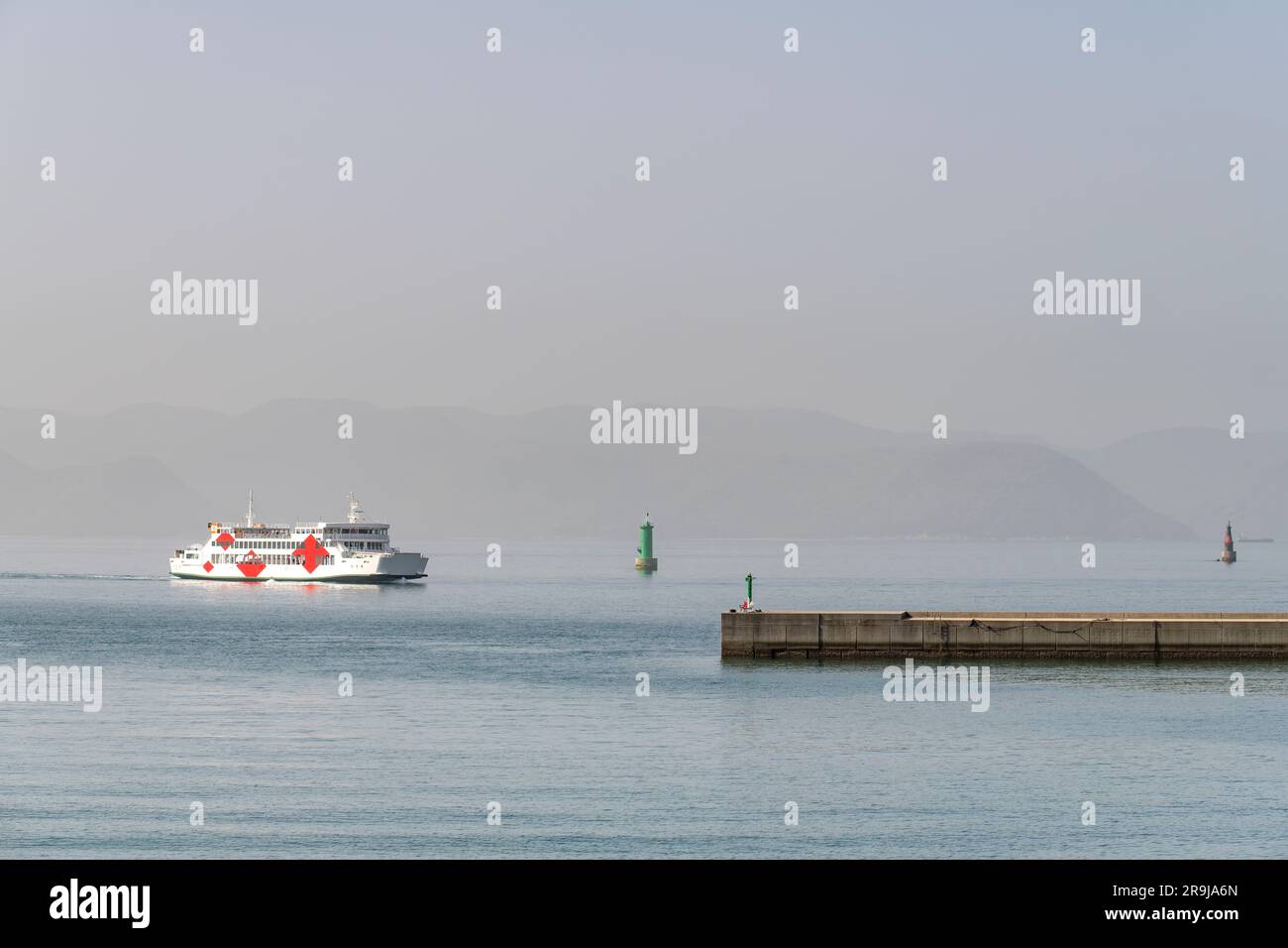 Naoshima Island, Japan-April 2023; View of ferry approaching Miyanoura ...