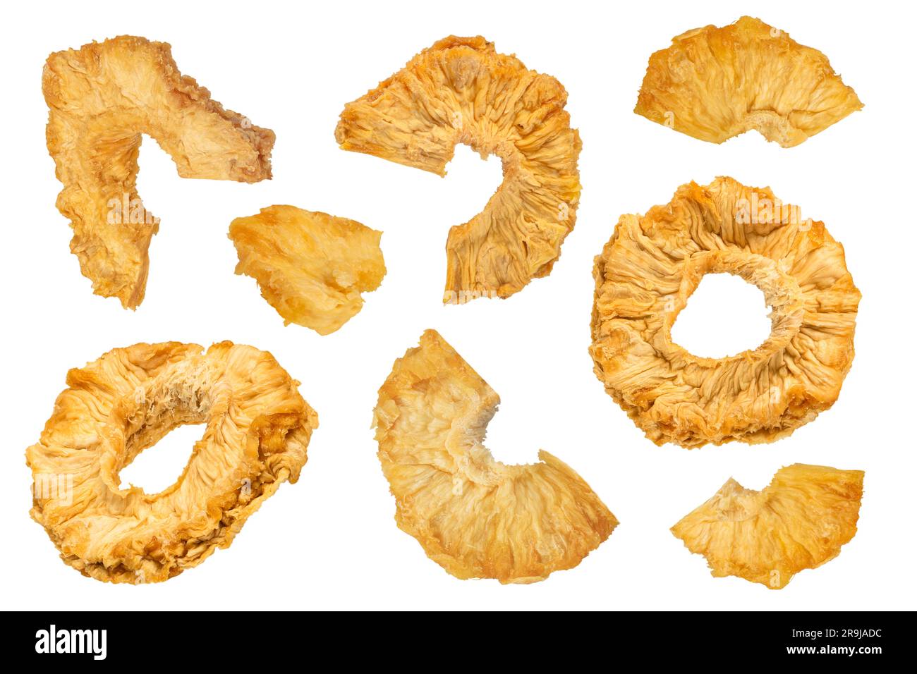 Dried pineapple slices on a white isolated background. Dried pineapples ...