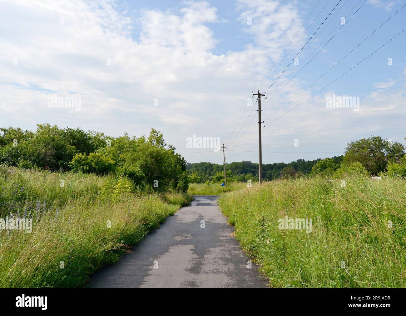 Beautiful empty asphalt road in countryside on colored background ...