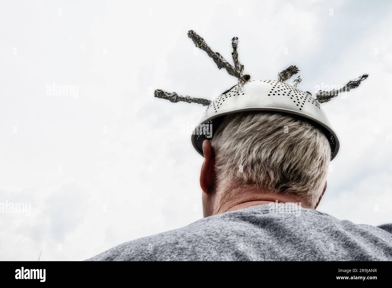 Man wearing tinfoil hat due to the superstition of extraterrestrial ...