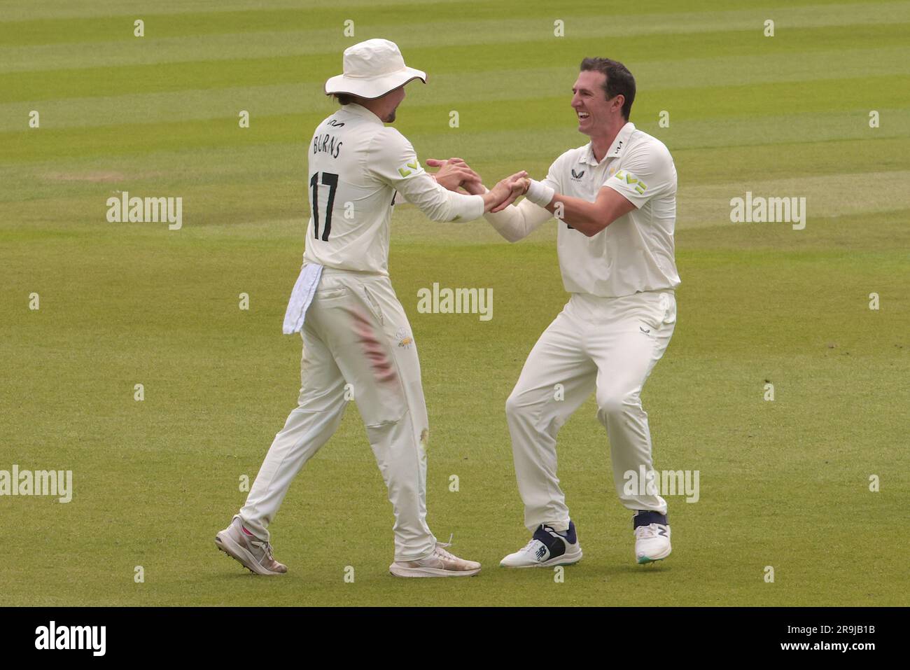 London, UK. , . Surrey's Rory Burns celebrates with bowler Dan Worrall ...