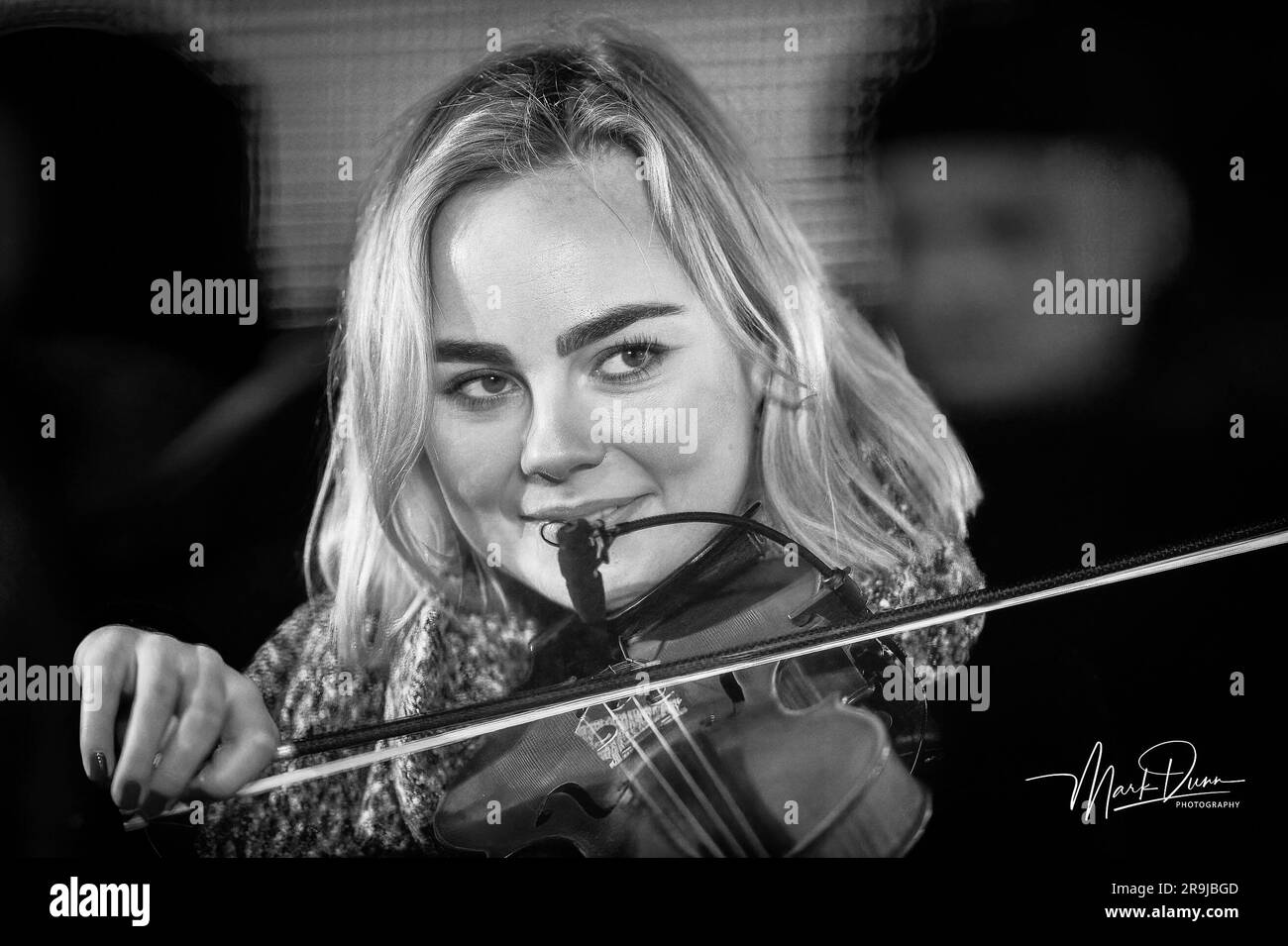 A female violinist playing in a band. Black and White Image. Picture ...