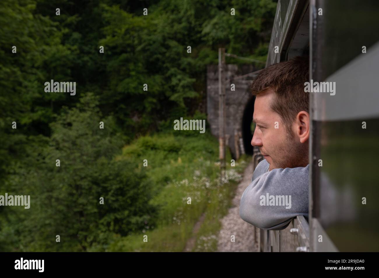 Attractive man traveling by railway through Balkans. Handsome young ...