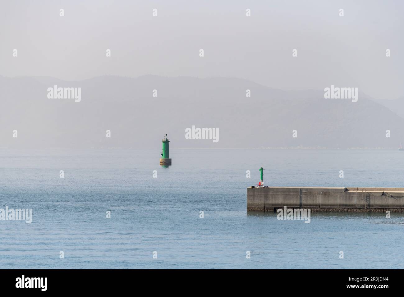 Partial view of the concrete wave barrier of Miyanoura Port on Naoshima ...