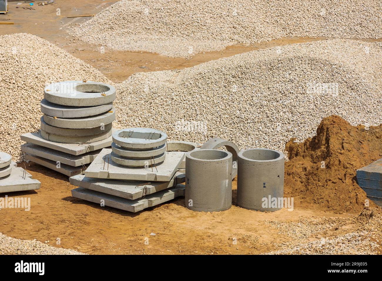 Construction concrete rings for laying pipes Stock Photo - Alamy
