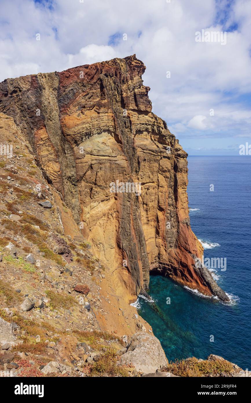 Steep cliffs and clear ocean water at the Ponta de Sao Lourenço, the ...