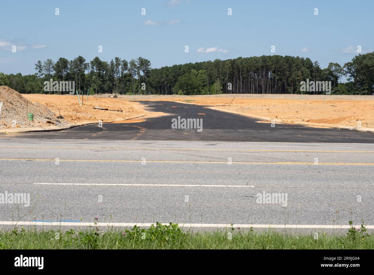 Asphalt road installed in a new residential subdivision Stock Photo - Alamy