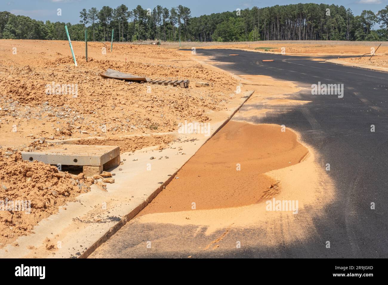 Asphalt road installed in a new residential subdivision Stock Photo - Alamy