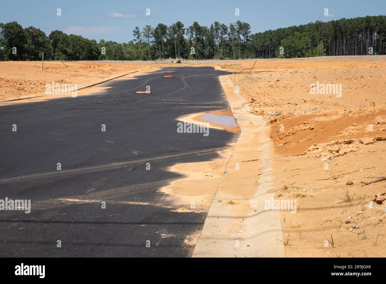 Asphalt road installed in a new residential subdivision Stock Photo - Alamy