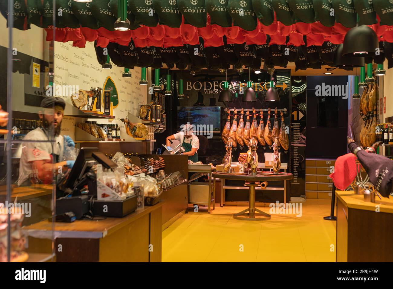 Spanish Bar and tapas cafe with dry-cured ham legs Stock Photo - Alamy