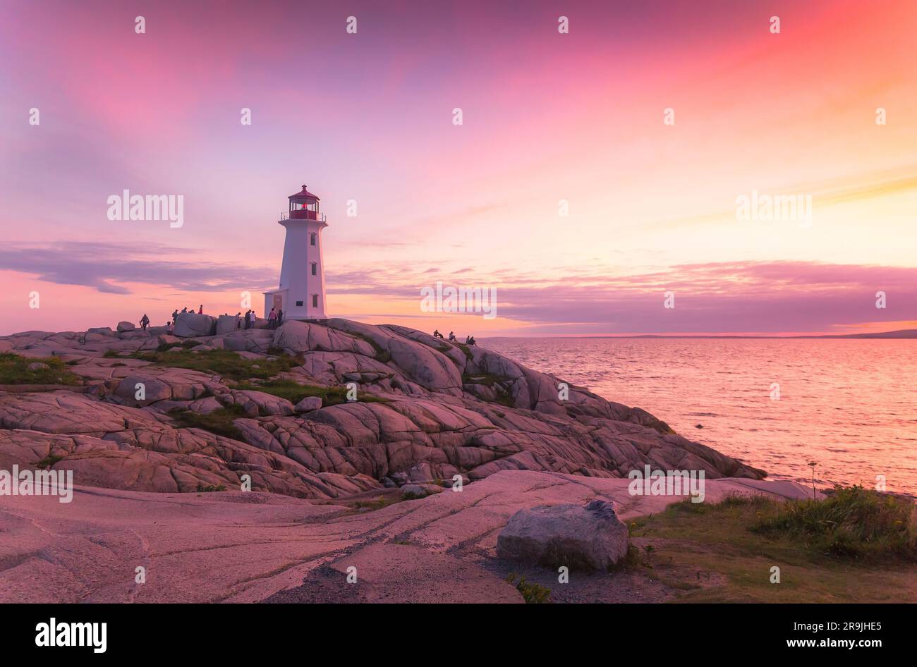 A dramatic sunset at Peggys Cove Lighthouse Atlantic Coast Nova Scotia ...