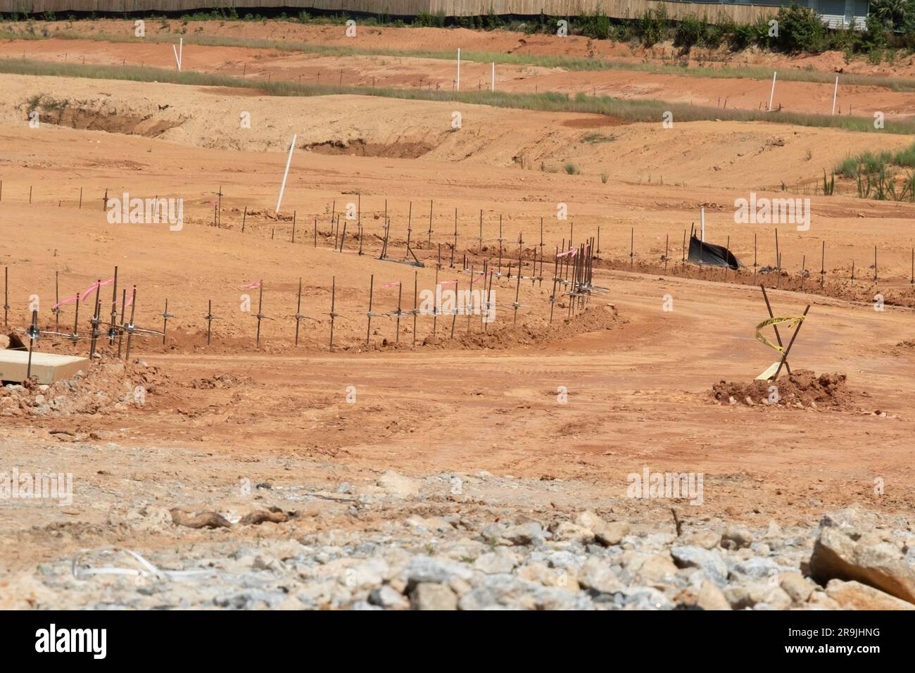 Metal posts for curb installation line a new subdivision road Stock ...