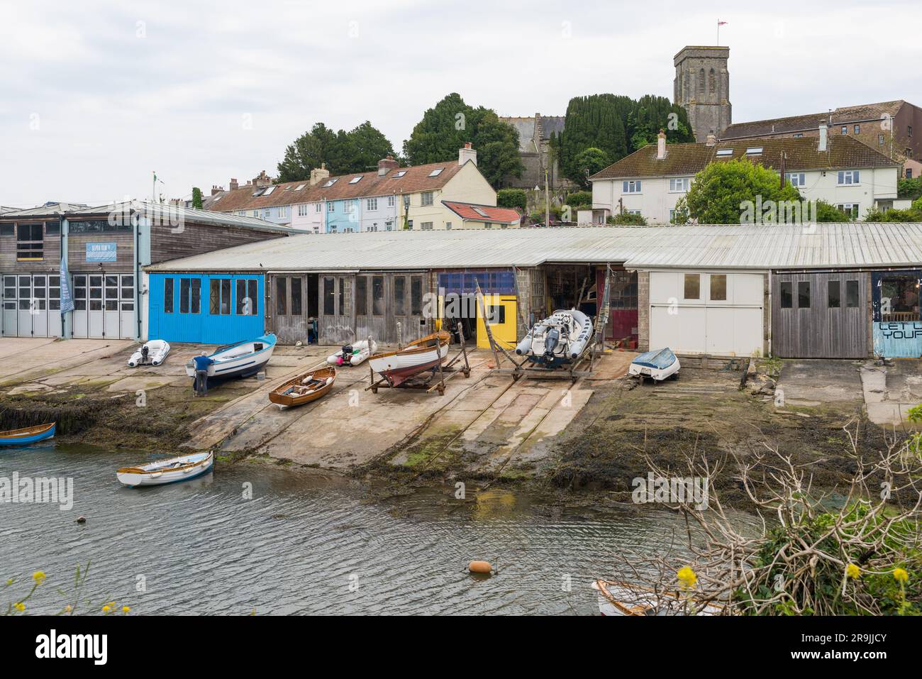 Slipways into the water at the rear of boat yards at shadycombe in salcombe, Devon Stock Photo ...