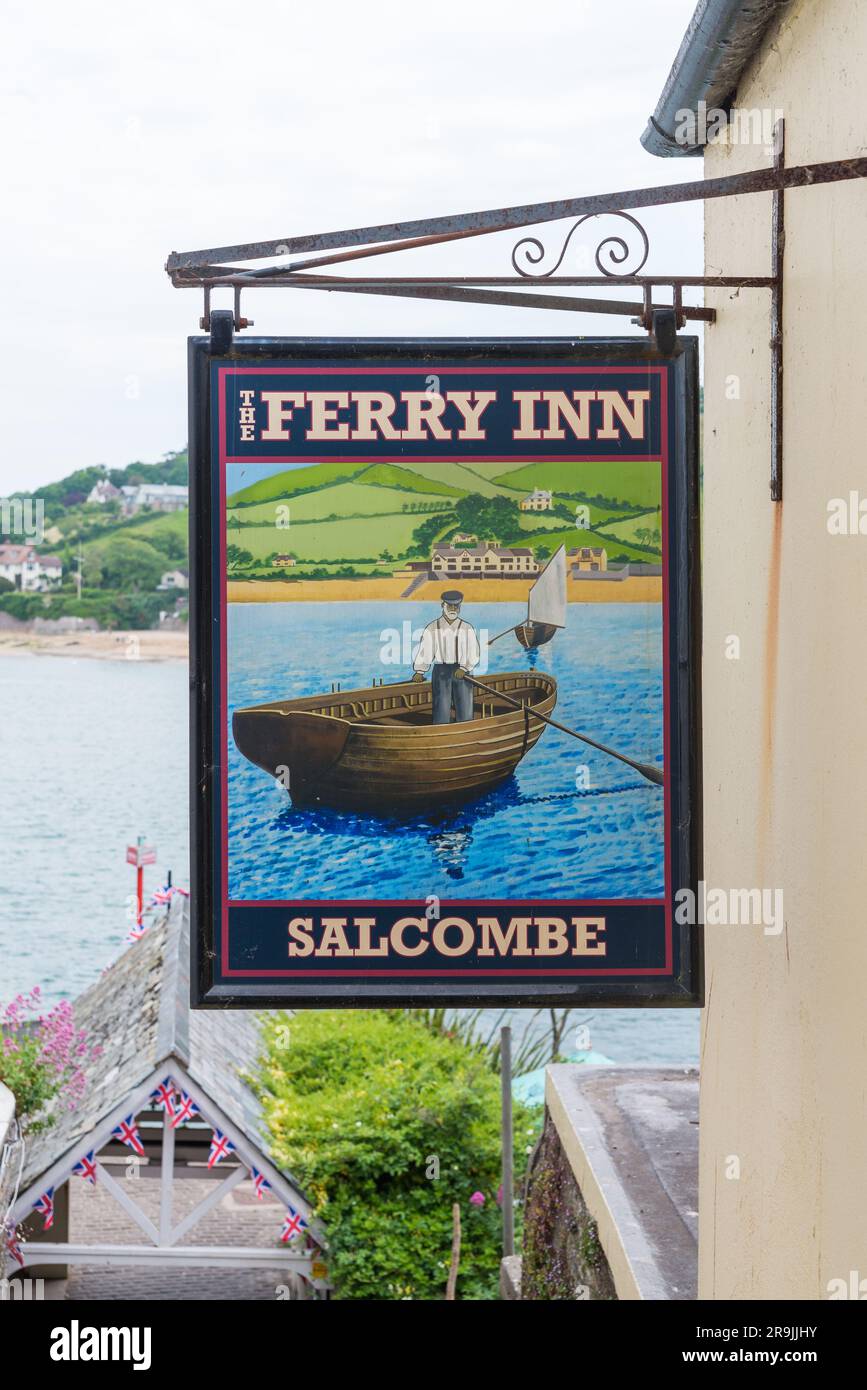 Colourful painted sign for the Ferry Inn pub in the coastal town of ...