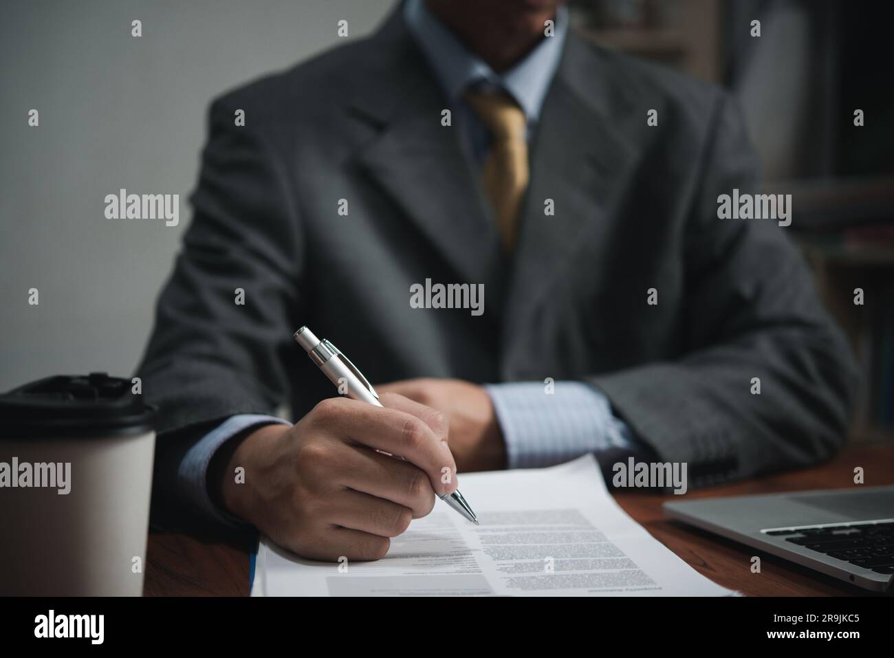 Businessman signs contract investment professional documents with a pen ...