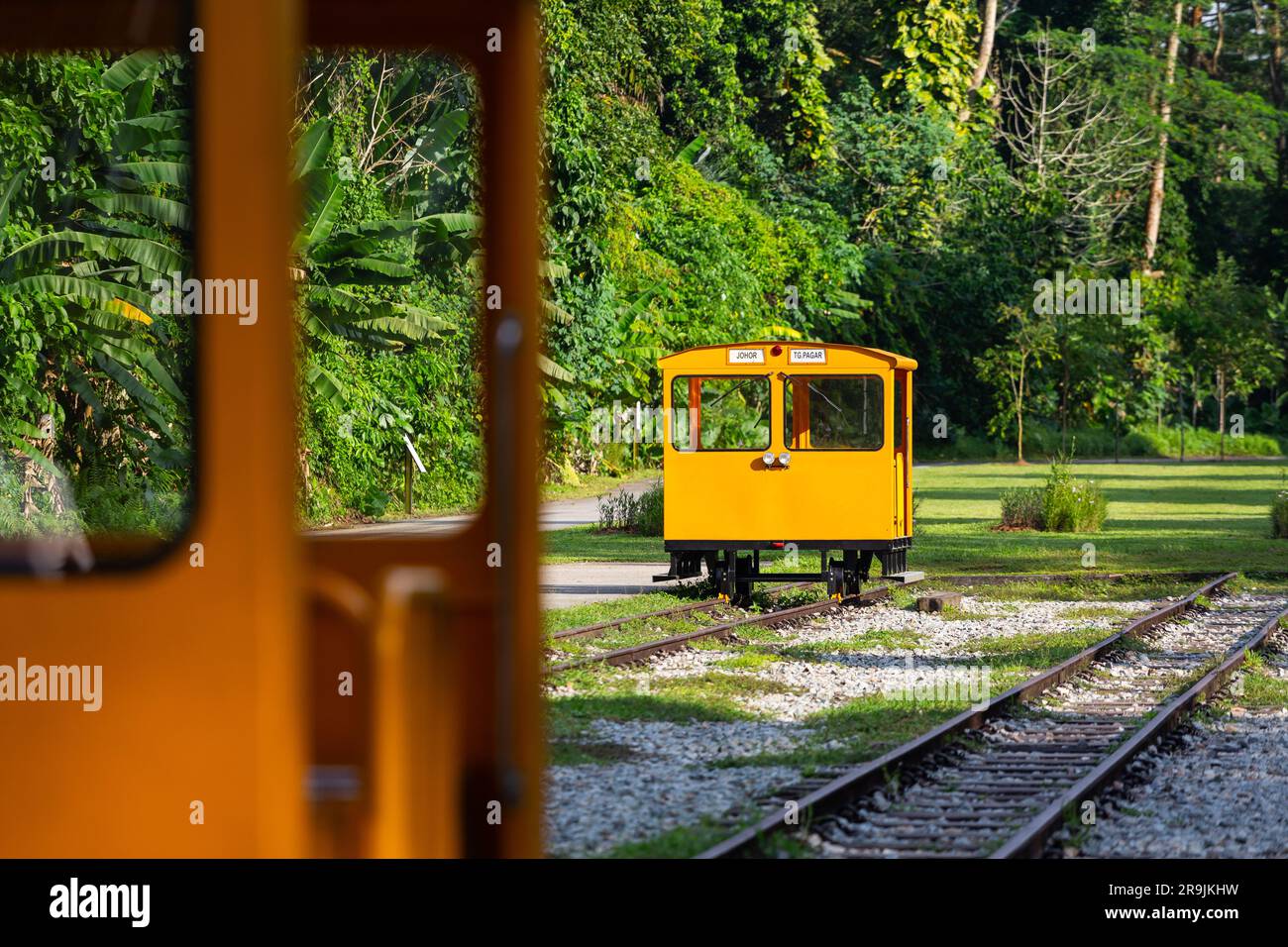 Bright yellow service wagons sitting on the railway tracks against the ...