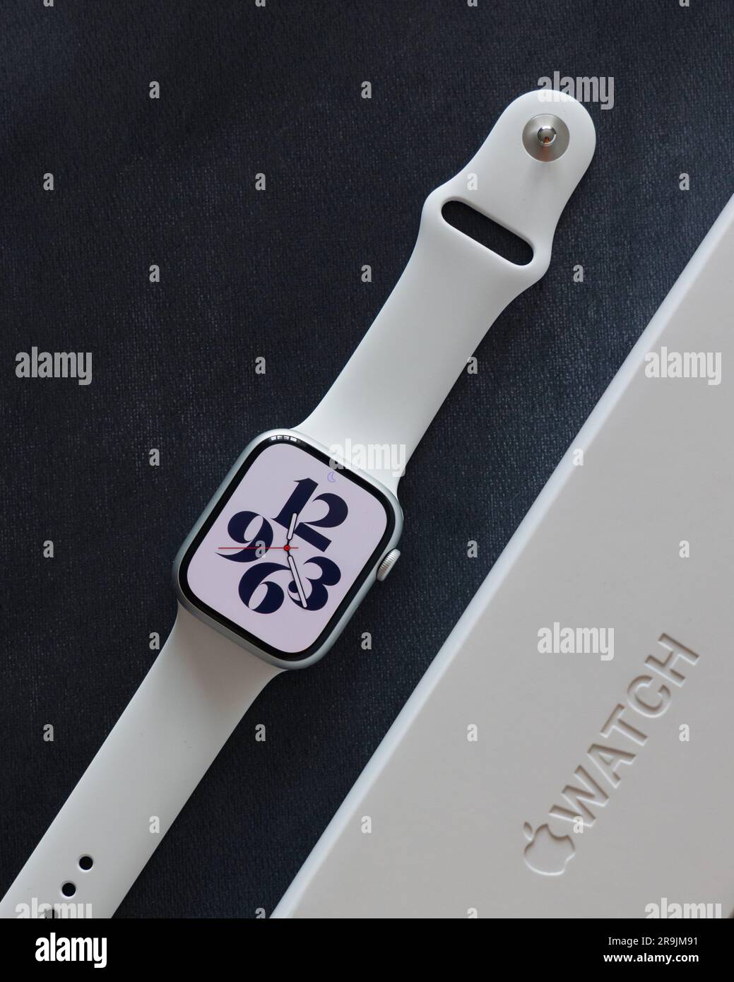 LONDON - JUNE 25, 2023: Apple Watch with white band strap and time ...