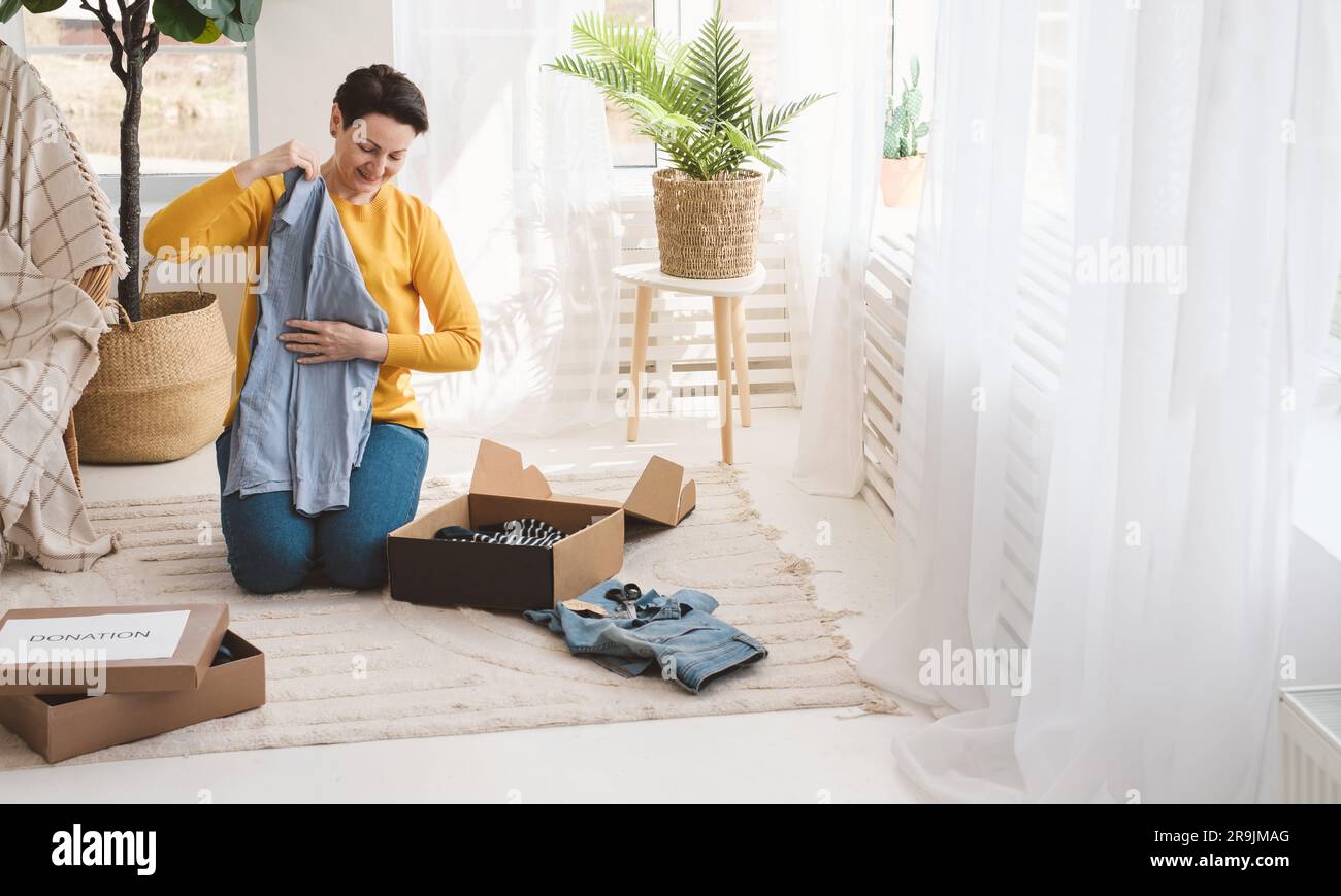 Folding clothes for packing hi-res stock photography and images - Alamy