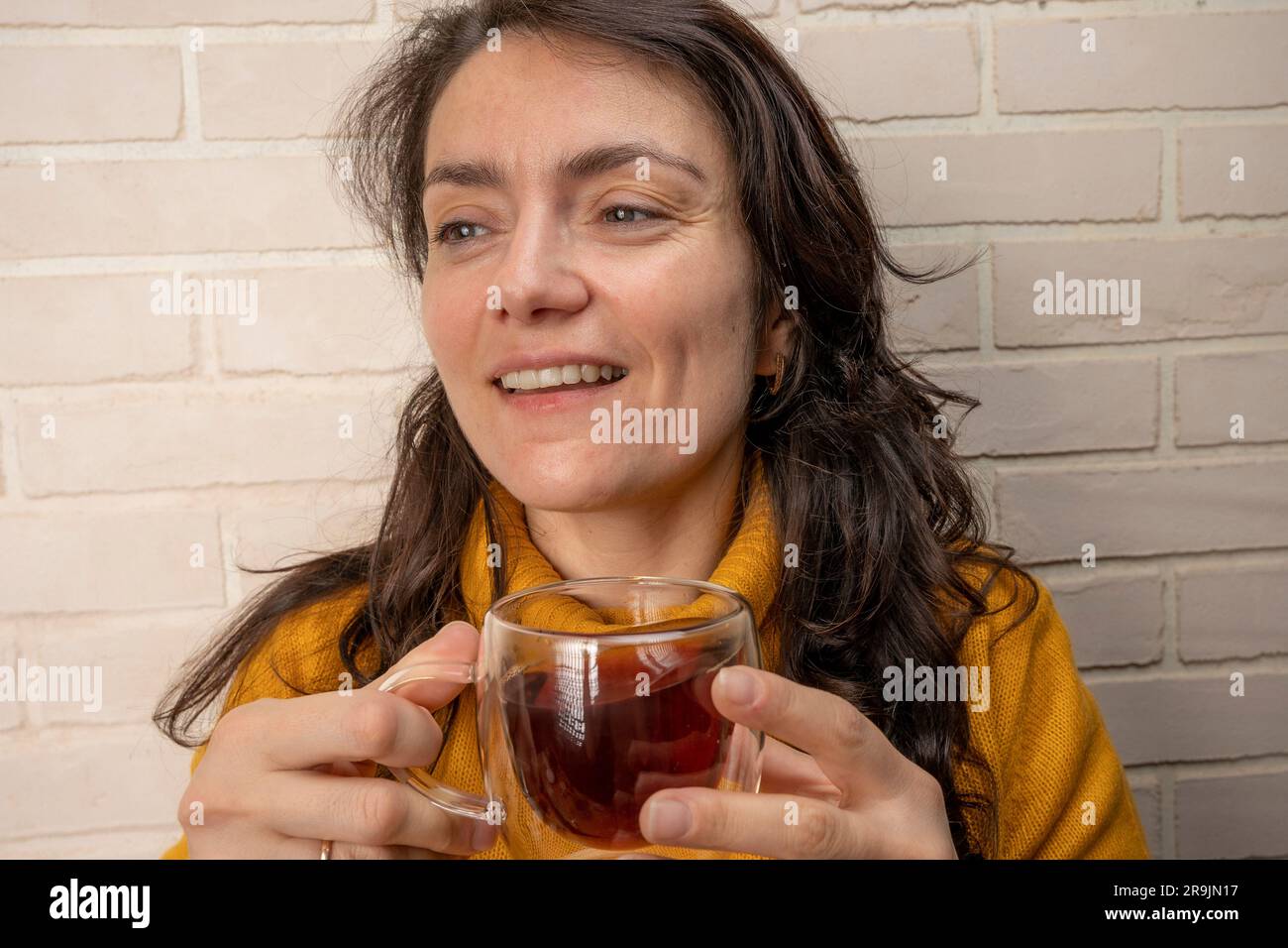 a pretty Caucasian middle-aged woman laughs while spending time with ...