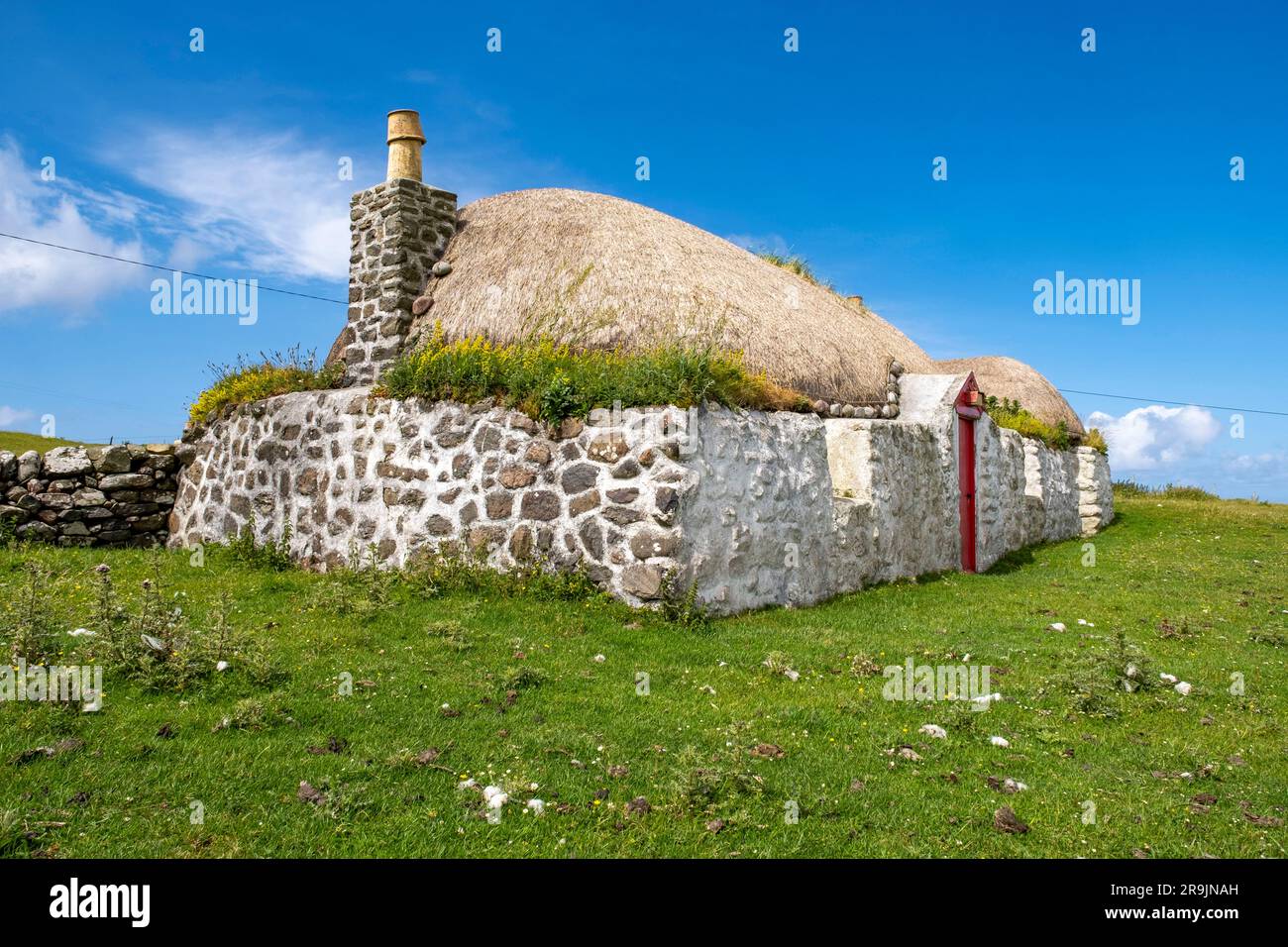 Traditional thatched blackhouse, Balevullin, Tiree, Inner Hebrides ...