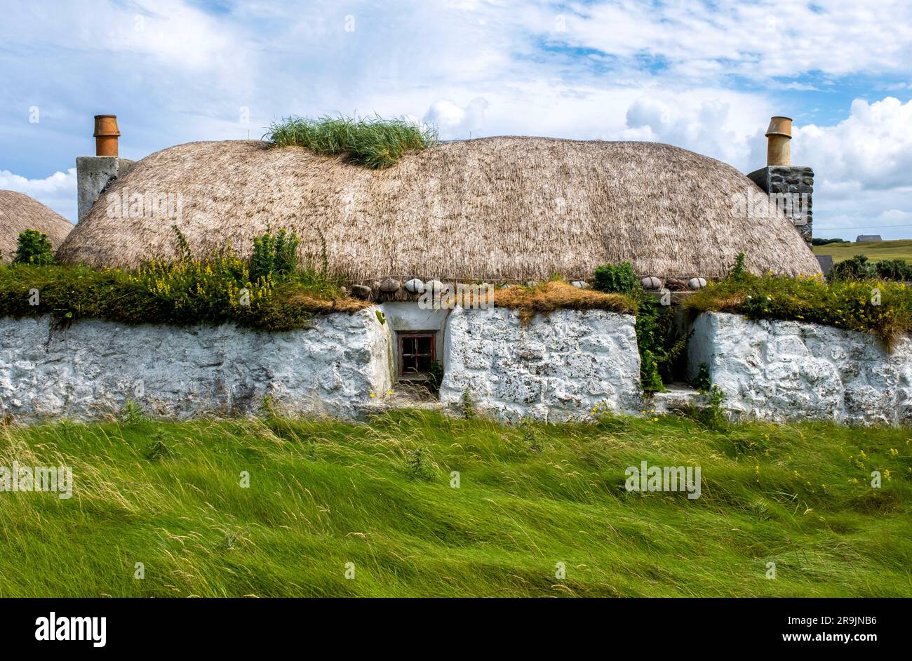 Traditional thatched blackhouse, Balevullin, Tiree, Inner Hebrides ...