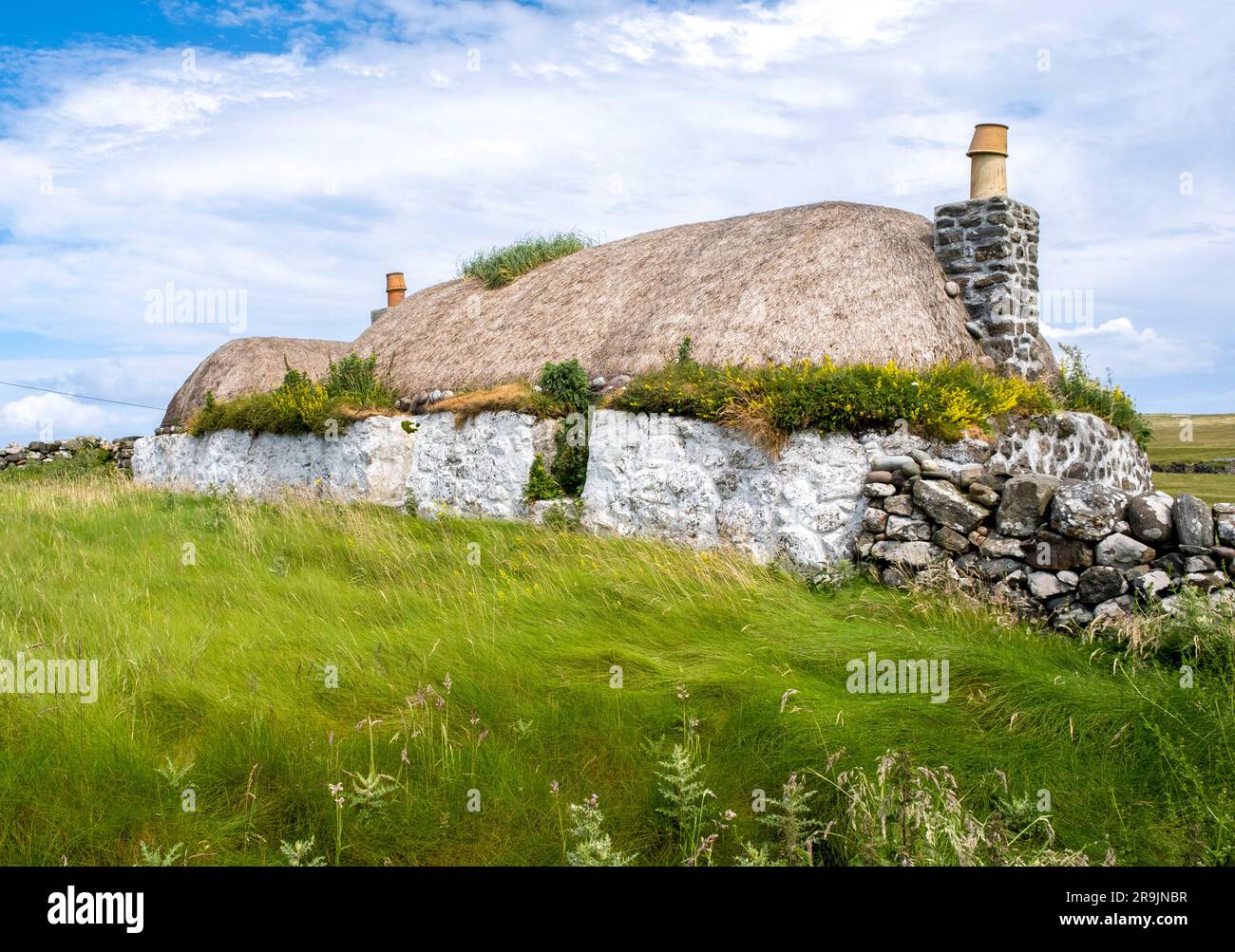 Traditional thatched blackhouse, Balevullin, Tiree, Inner Hebrides ...