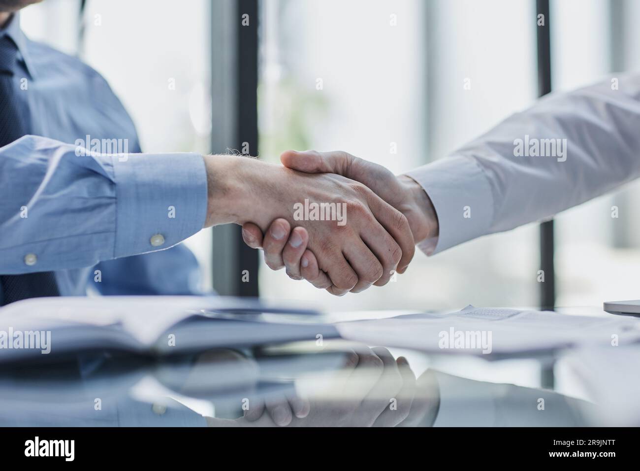 business men handshaking after close deal and signed agreement at ...